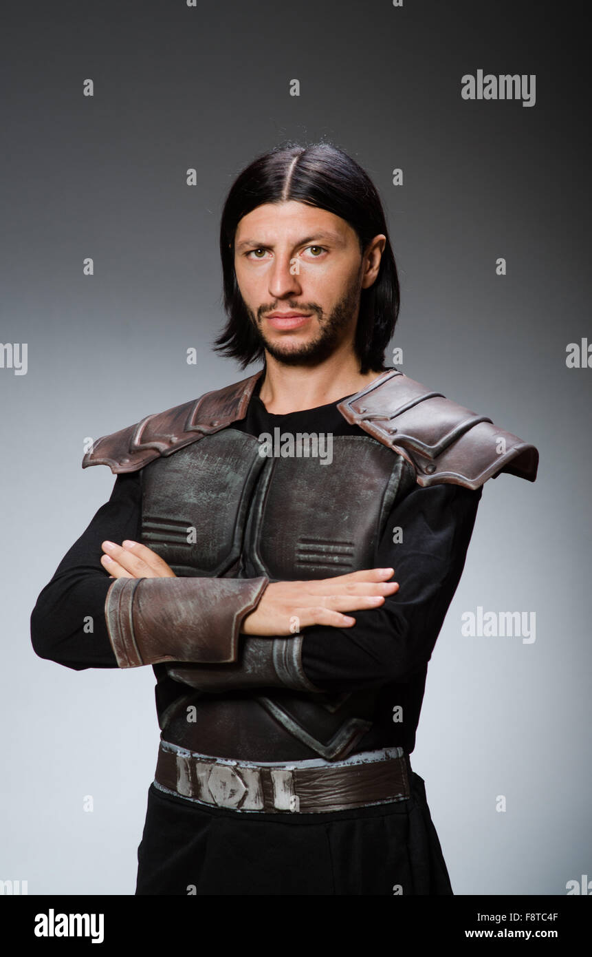 Angry warrior against dark background Stock Photo - Alamy