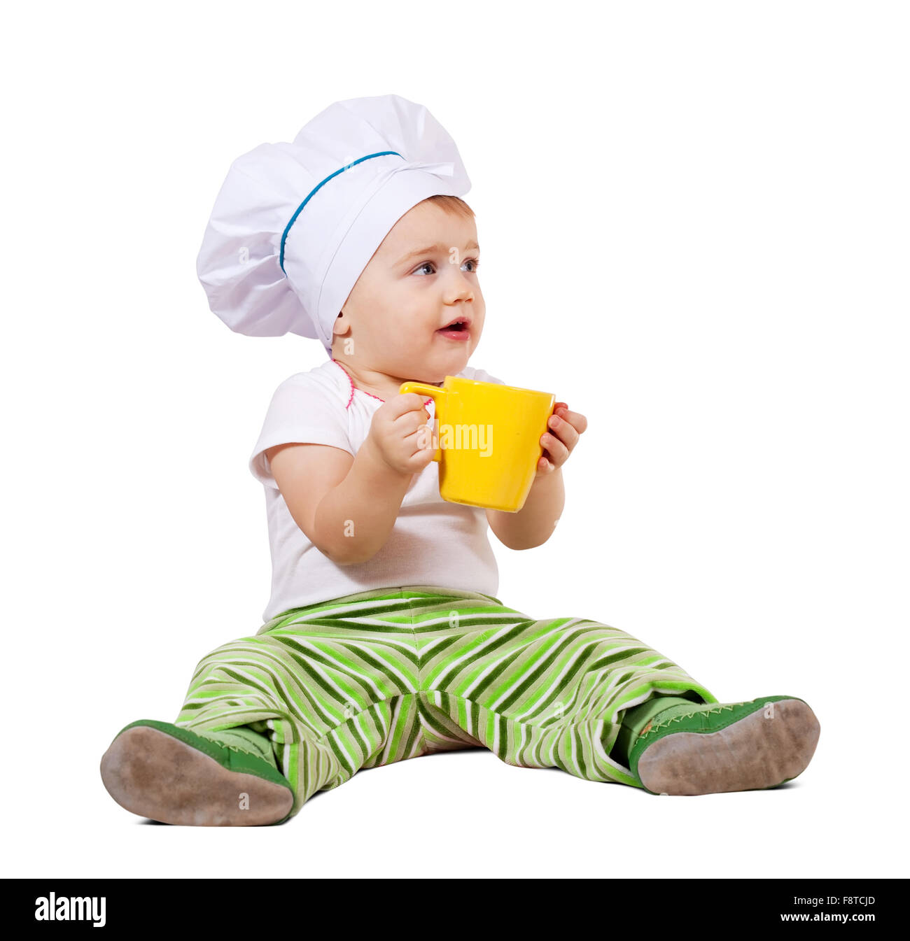 Baby cook in toque with cup over white background Stock Photo - Alamy