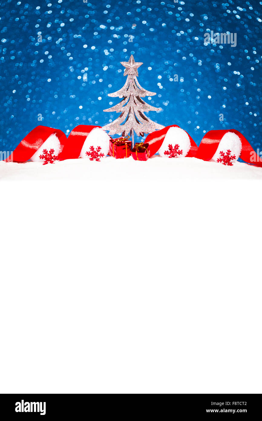 christmas tree in snow on glitter background Stock Photo - Alamy