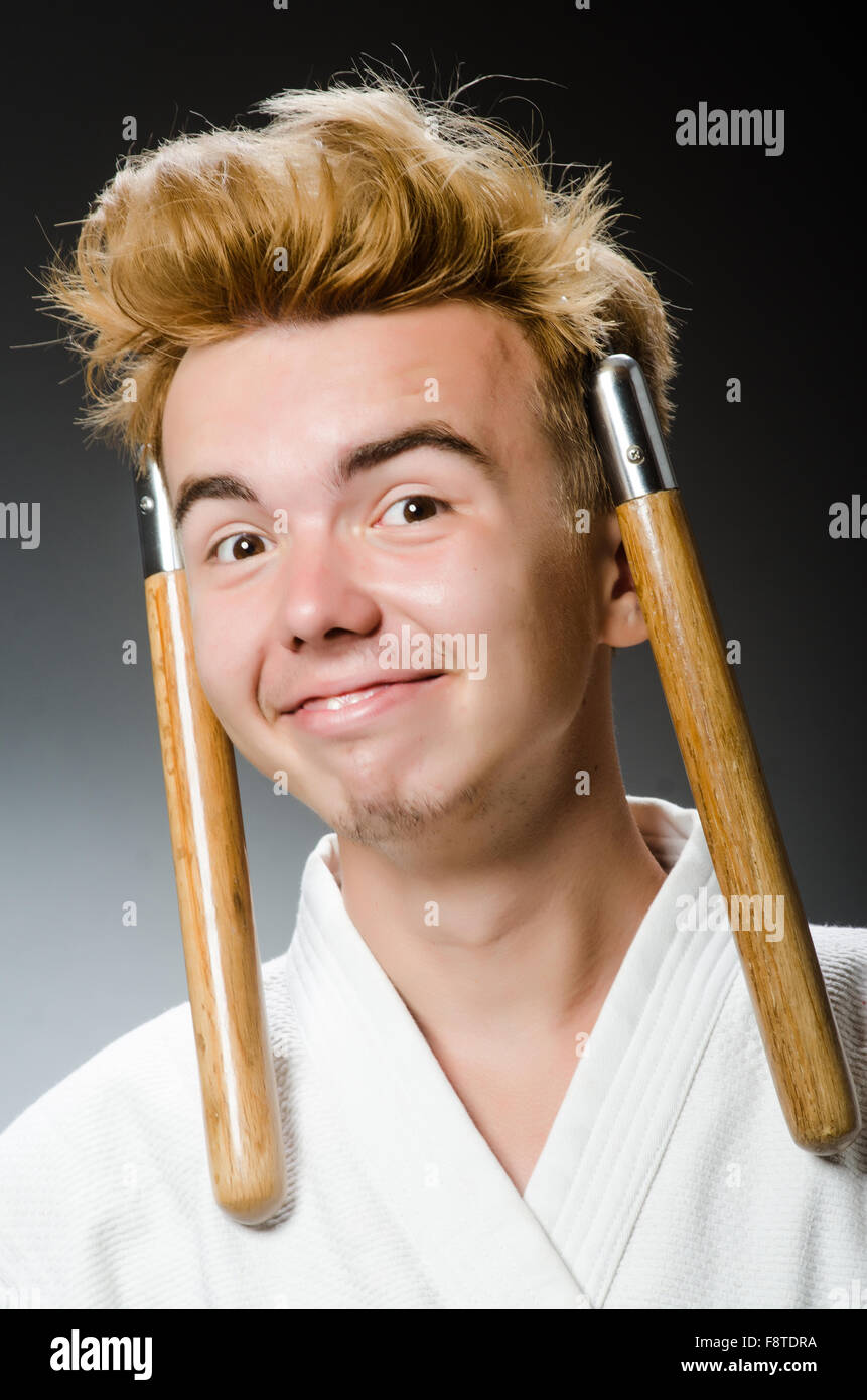 Funny karate fighter with nunchucks Stock Photo - Alamy