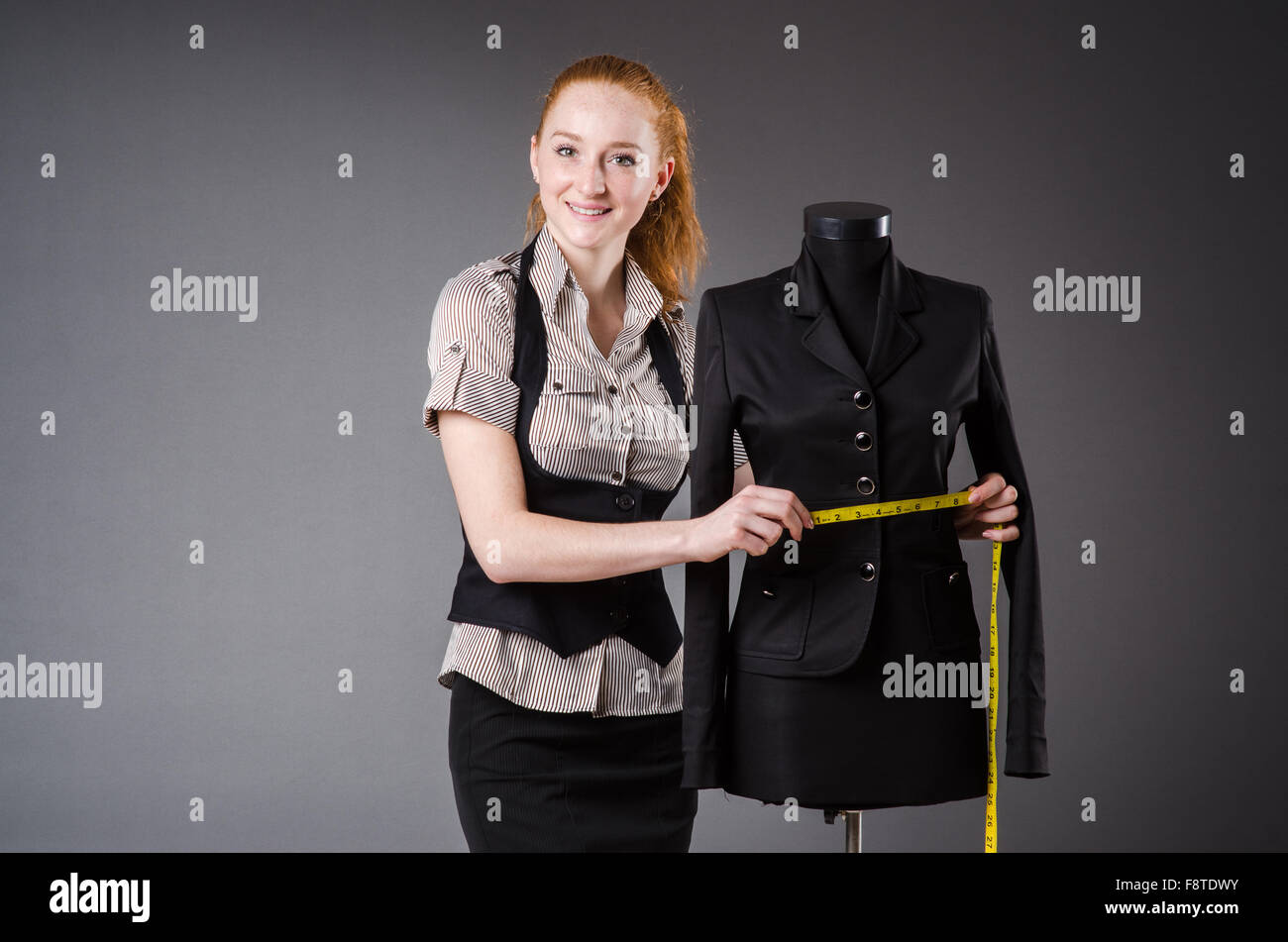 Woman tailor working on new dress Stock Photo - Alamy