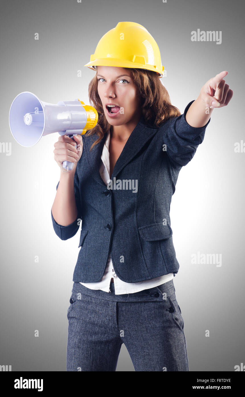 Female construction worker with loudspeaker Stock Photo - Alamy