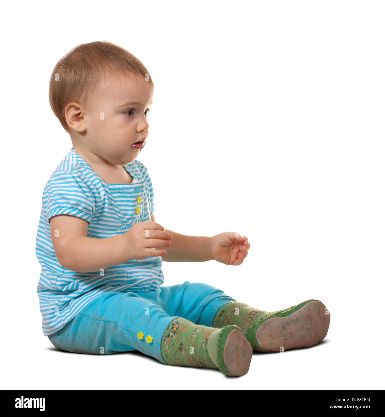 Sitting toddler. Isolated over white background with shadow Stock Photo ...