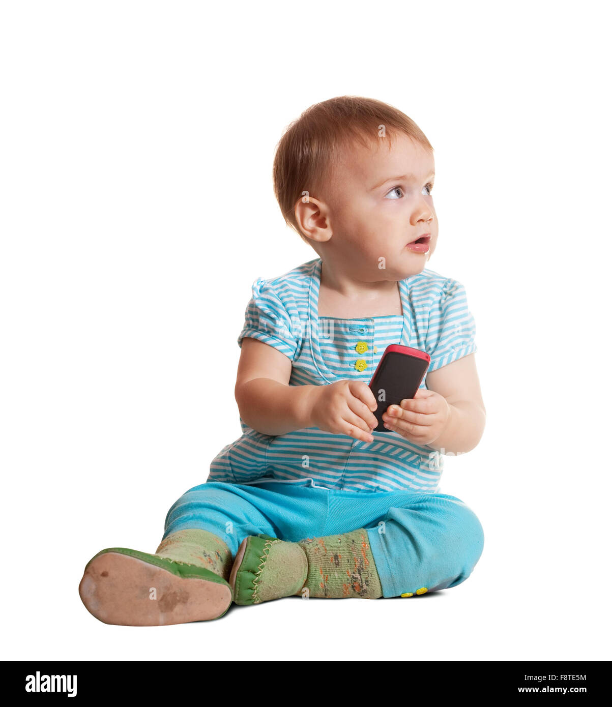Toddler using mobile phone over white background Stock Photo - Alamy