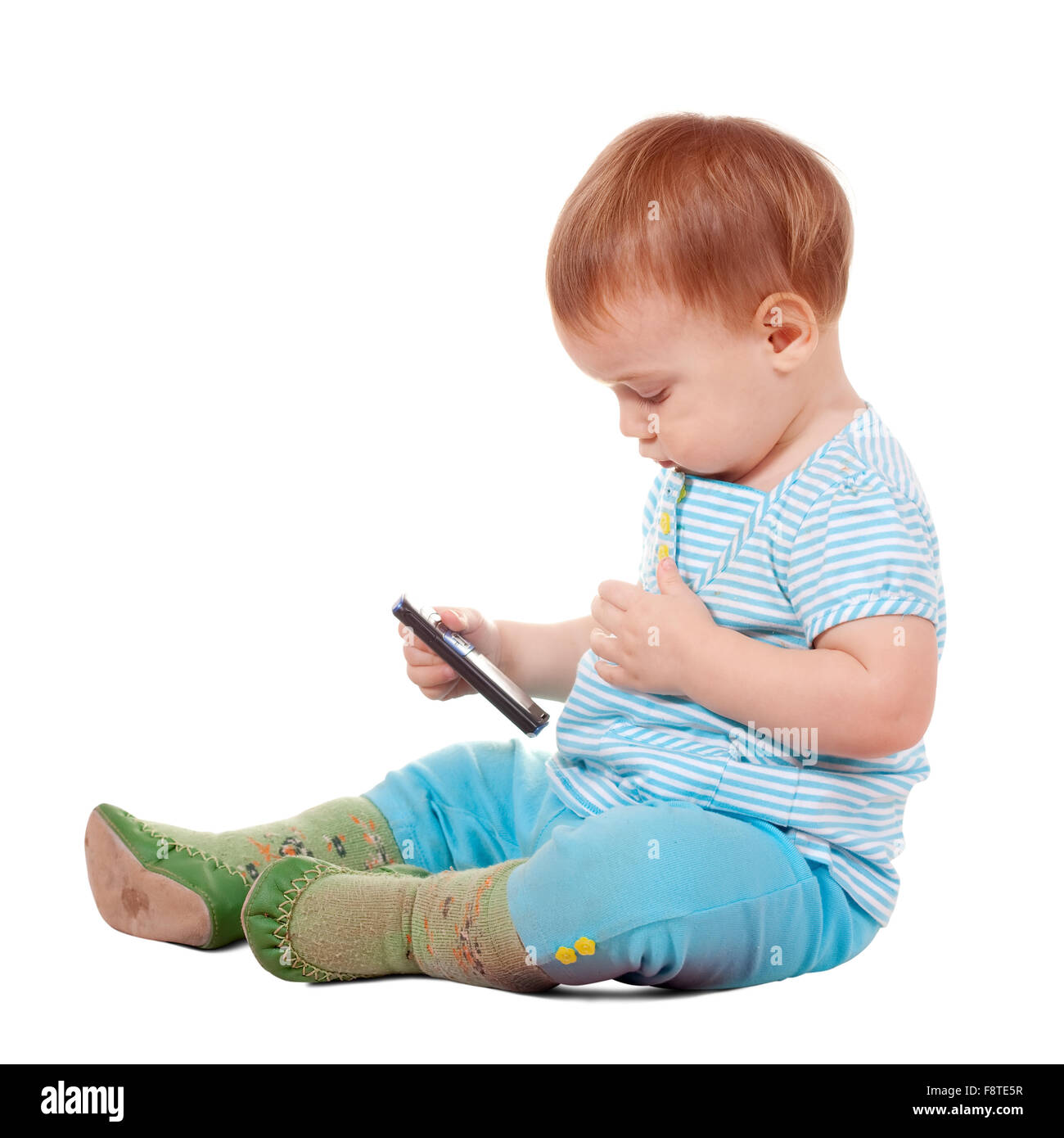 Toddler using mobile phone over white background Stock Photo - Alamy