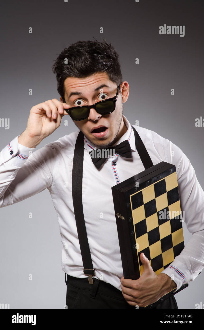 Funny chess player with board Stock Photo - Alamy