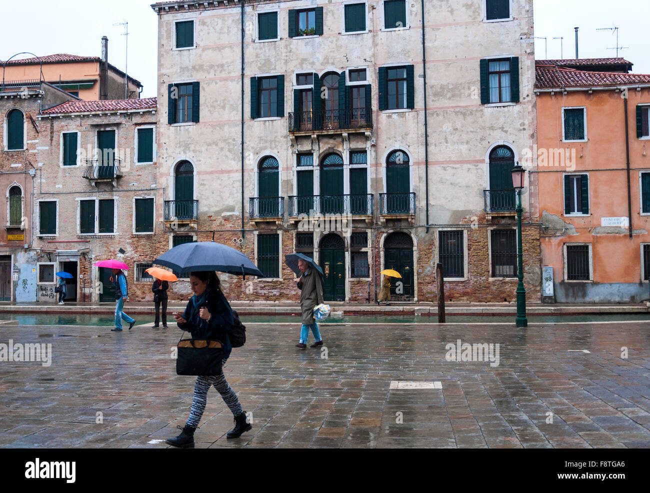 Campo San Barnaba, Venice, Italy. Six umbrellas on a rainy day Stock ...