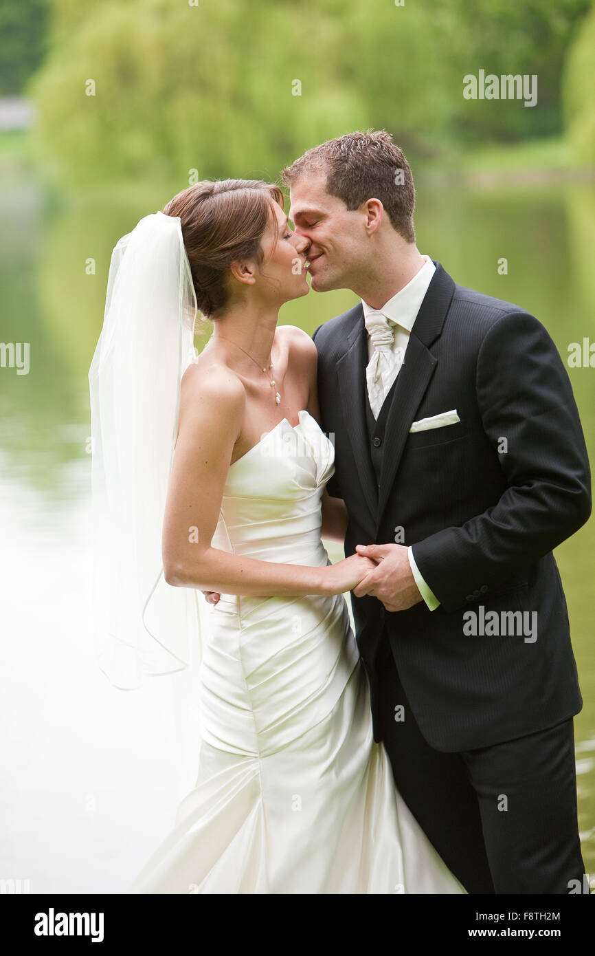 Kissing the bride Stock Photo - Alamy
