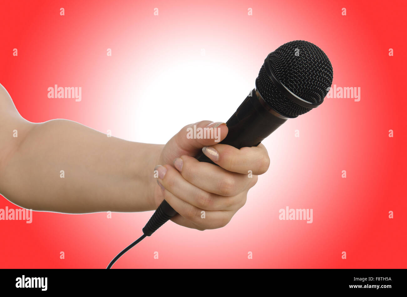Hand with microphone on white Stock Photo - Alamy