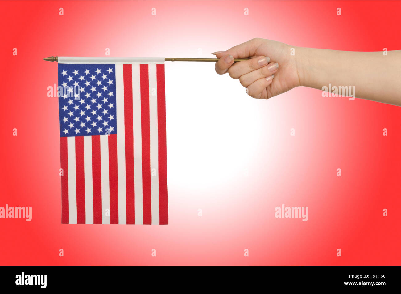 Hand holding american flag on white Stock Photo - Alamy