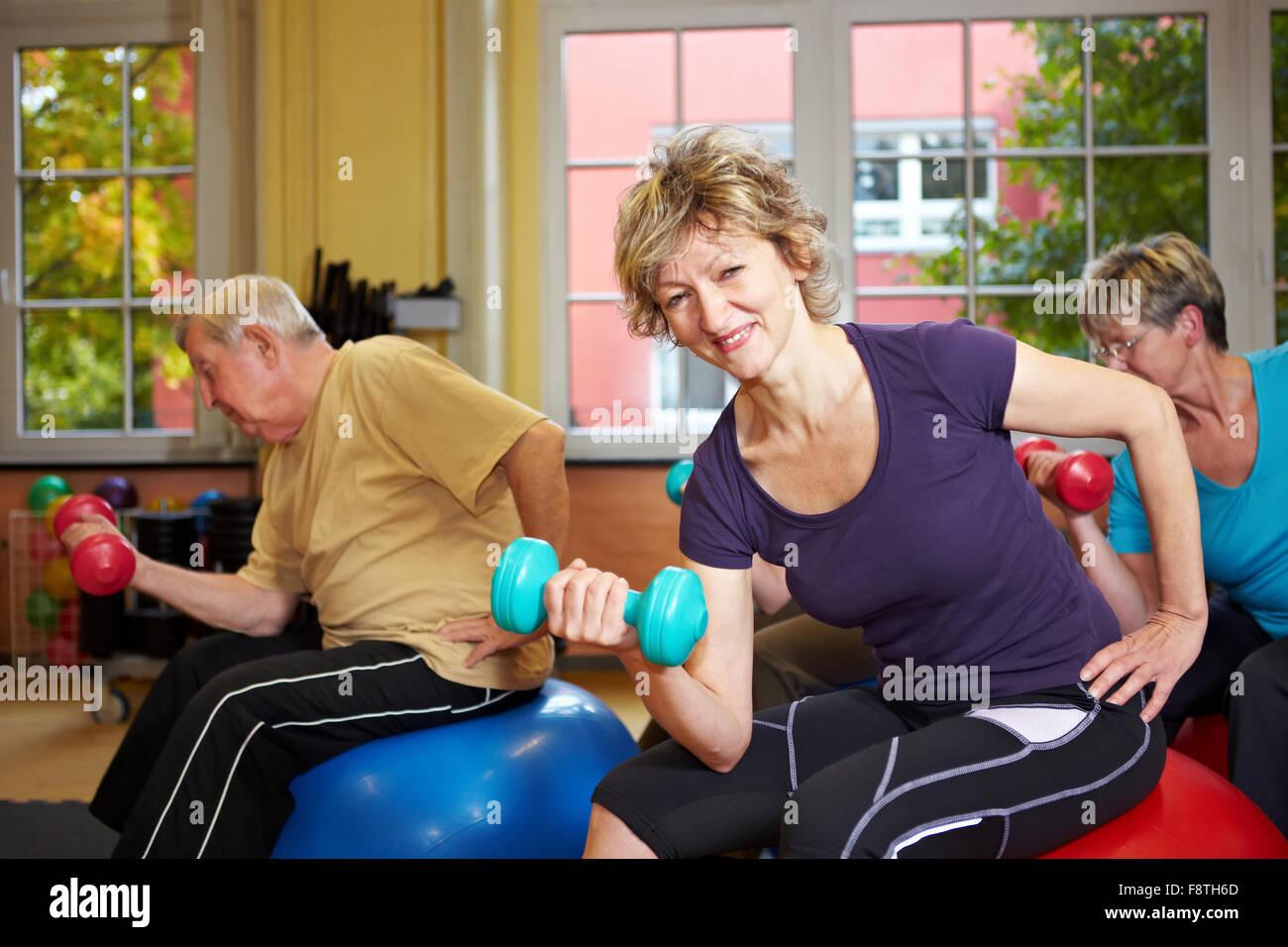 Group doing dumbbell exercises hi-res stock photography and images - Alamy