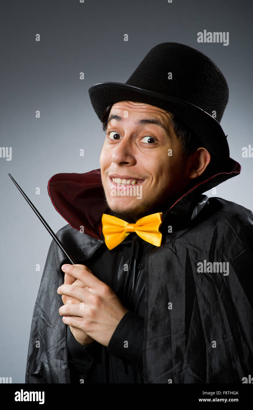 Funny magician man with wand and hat Stock Photo - Alamy