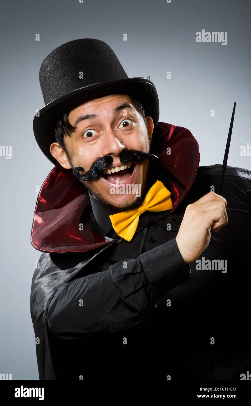 Funny magician man with wand and hat Stock Photo - Alamy