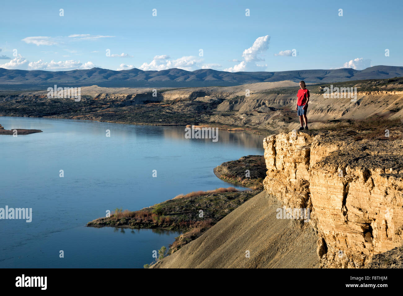 WASHINGTON - Hiker on the White Bluffs rising above the Columbia River ...