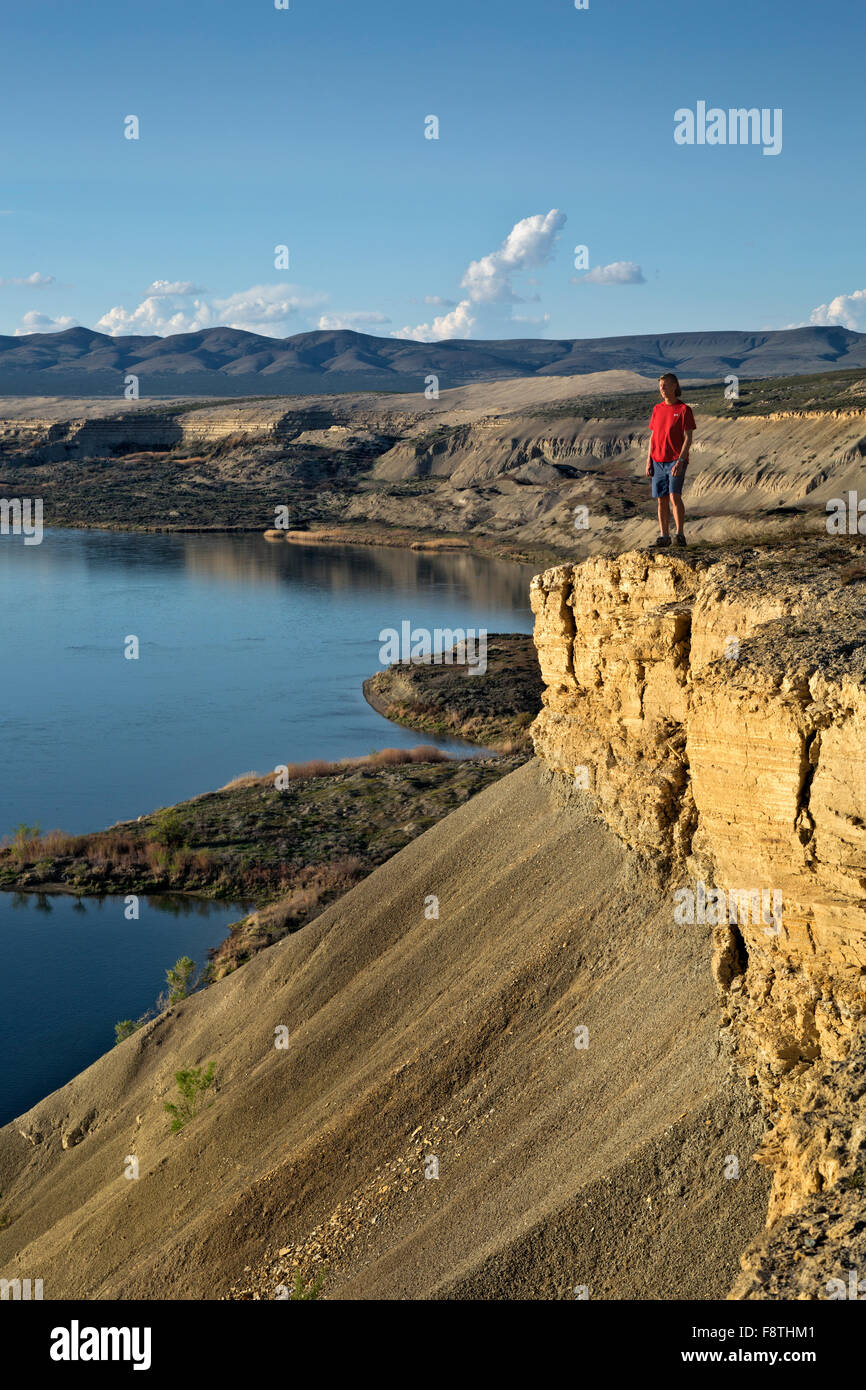 WASHINGTON - Hiker on the White Bluffs rising above the Columbia River ...