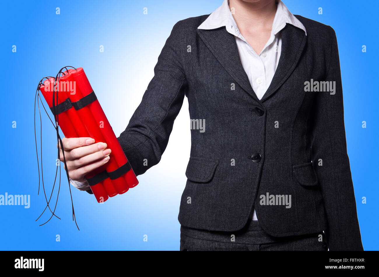 Hand holding bars of dynamite on white Stock Photo - Alamy