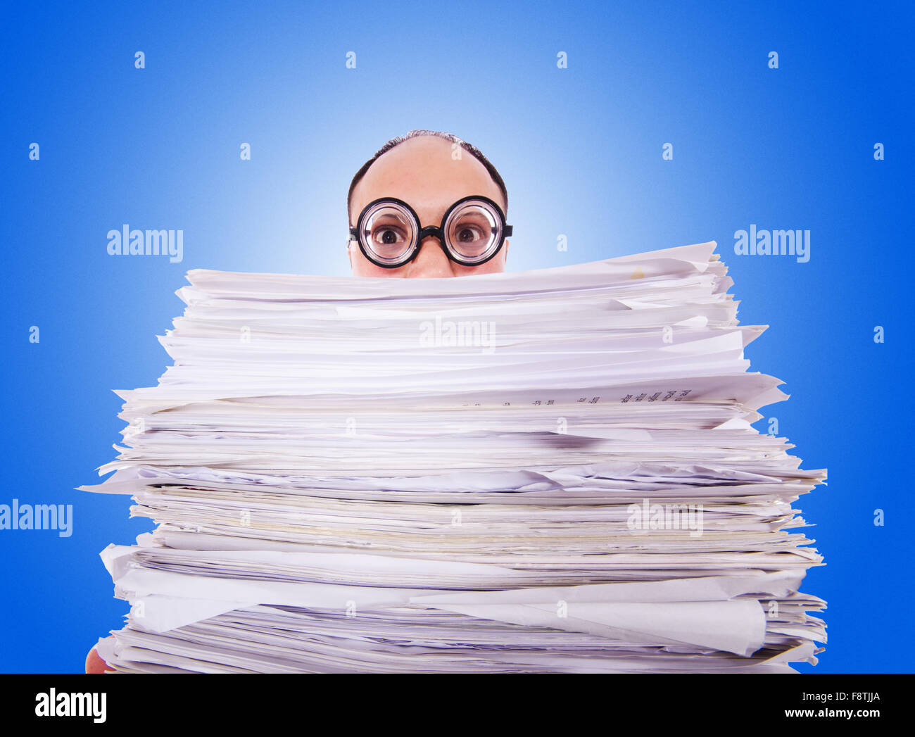 Funny man with lots of folders on white Stock Photo - Alamy