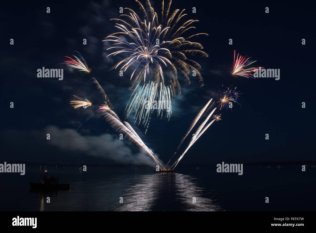 Fireworks over water Stock Photo - Alamy