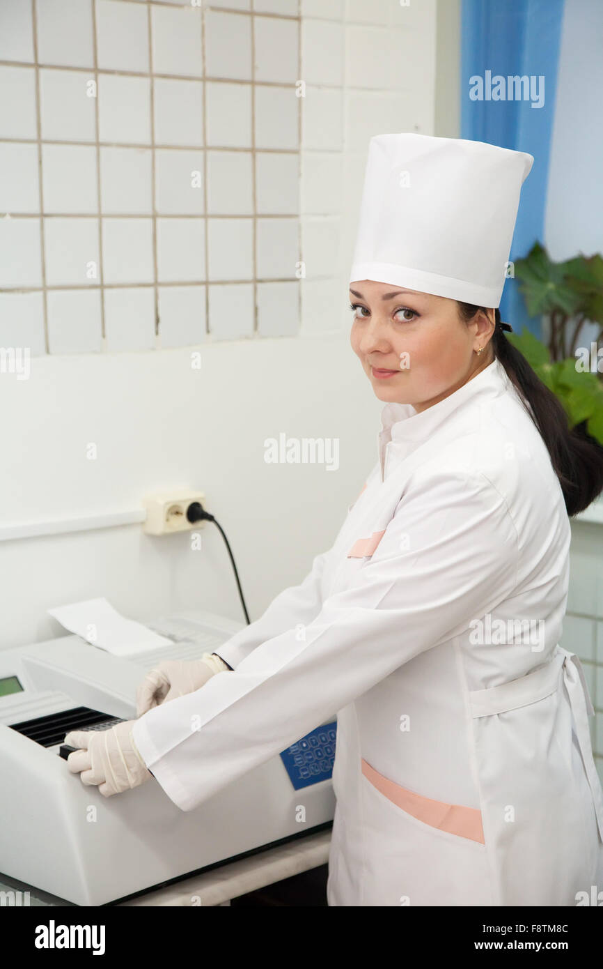 Doctor working biochemistry analyzer in hi-res stock photography and ...