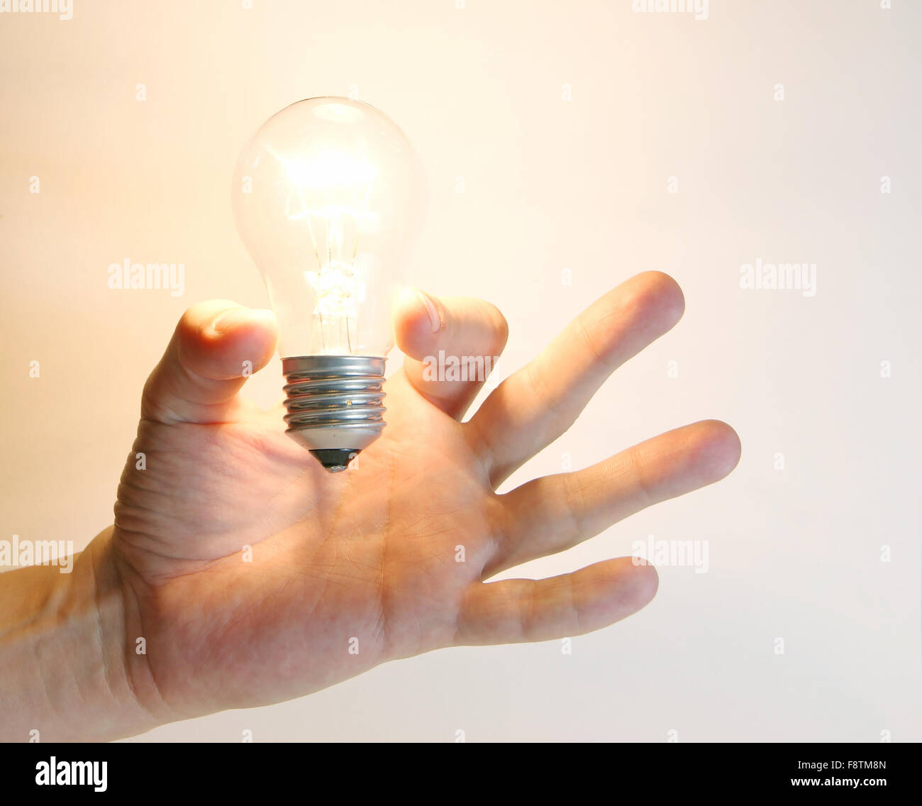 Lighting lamp flashing bulb in human hand on white background new idea ...