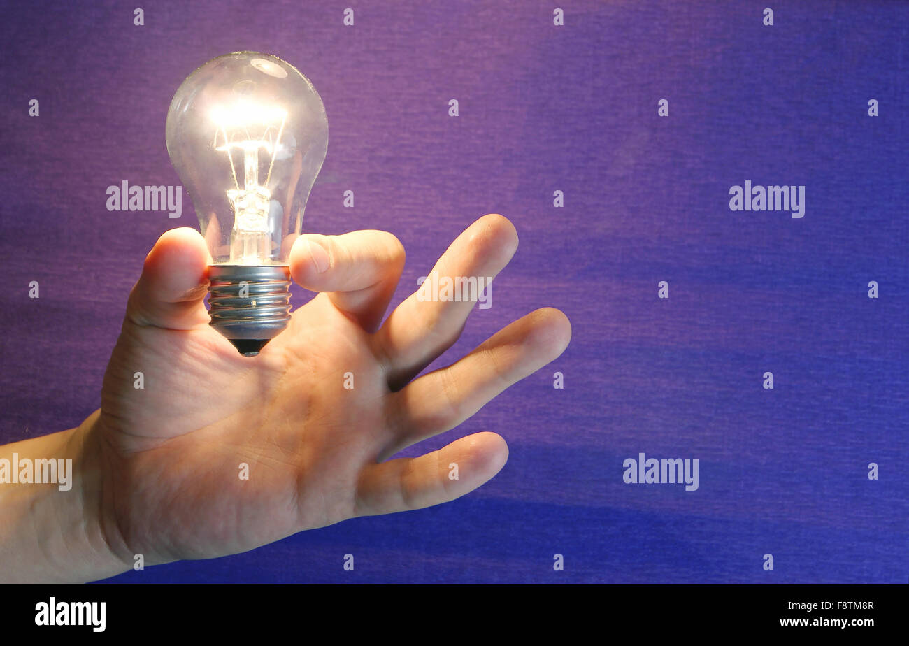 Human hand holding light bulb hi-res stock photography and images - Alamy