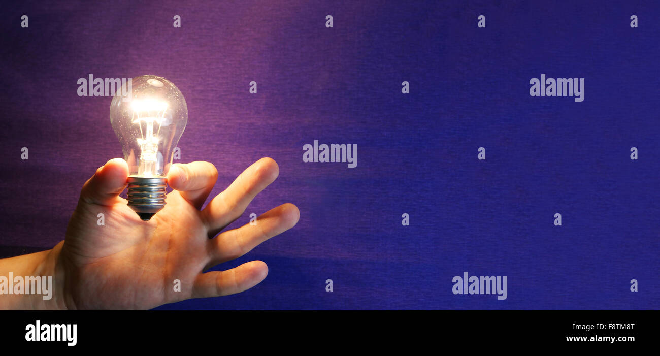 Human hand holding light bulb hi-res stock photography and images - Alamy