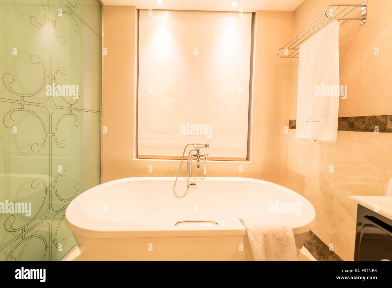 Modern bathroom interior with bathtub Stock Photo - Alamy