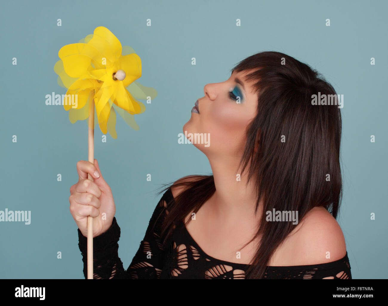 Girl with a pinwheel hi-res stock photography and images - Alamy