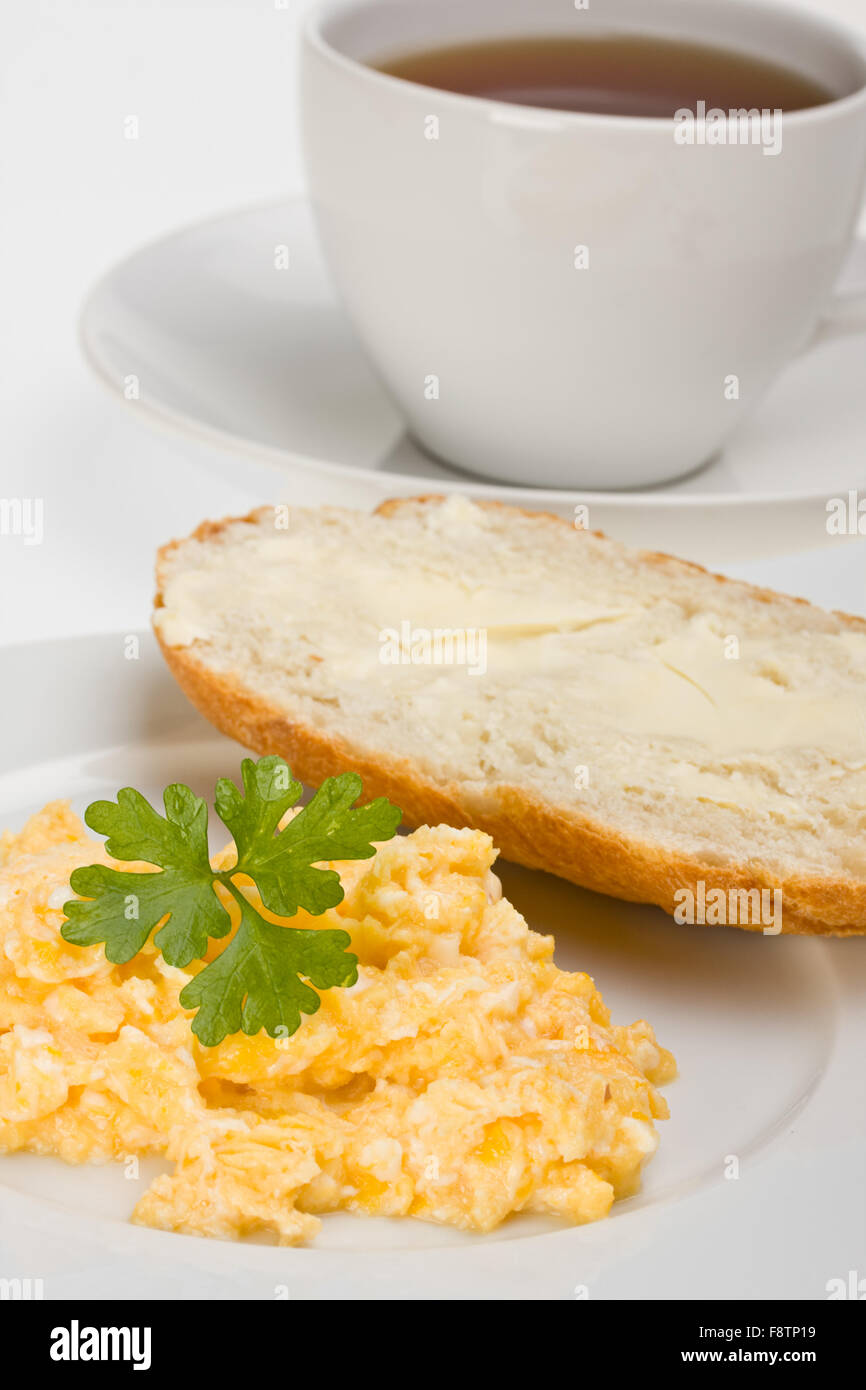 scrambled eggs and bun on a plate Stock Photo - Alamy