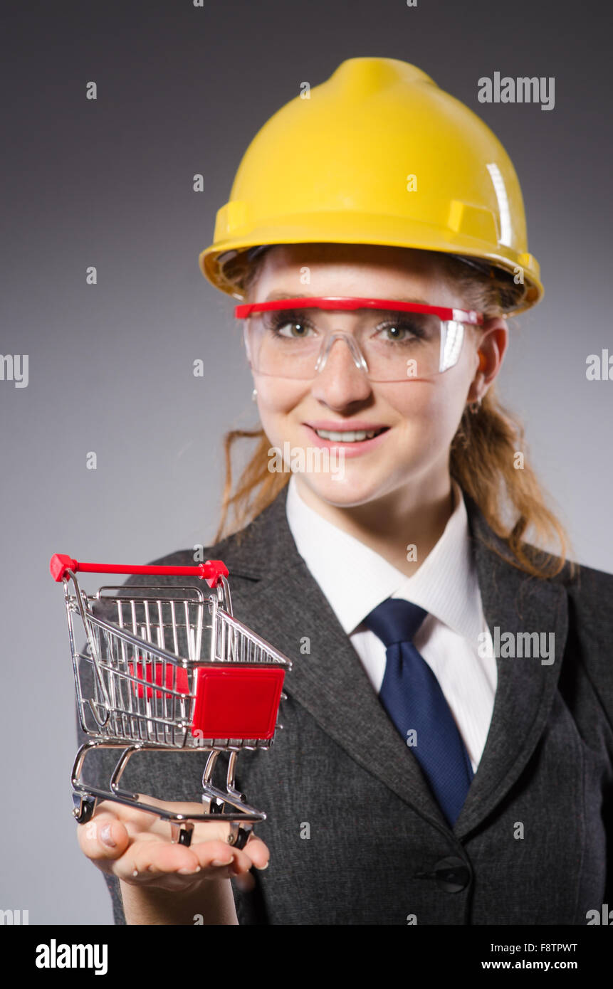 Female engineer with helmet isolated on gray Stock Photo - Alamy