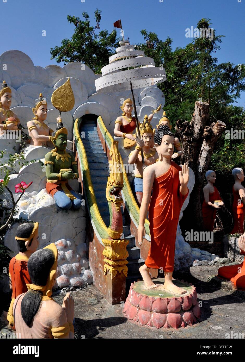 Bang Saen, Thailand: Colourful statues of orange-robed monks, deities ...