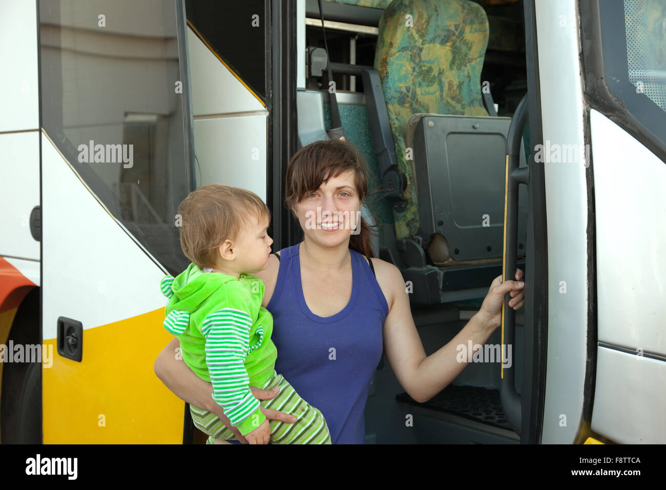 Mother and child traveling on commercial bus Stock Photo - Alamy