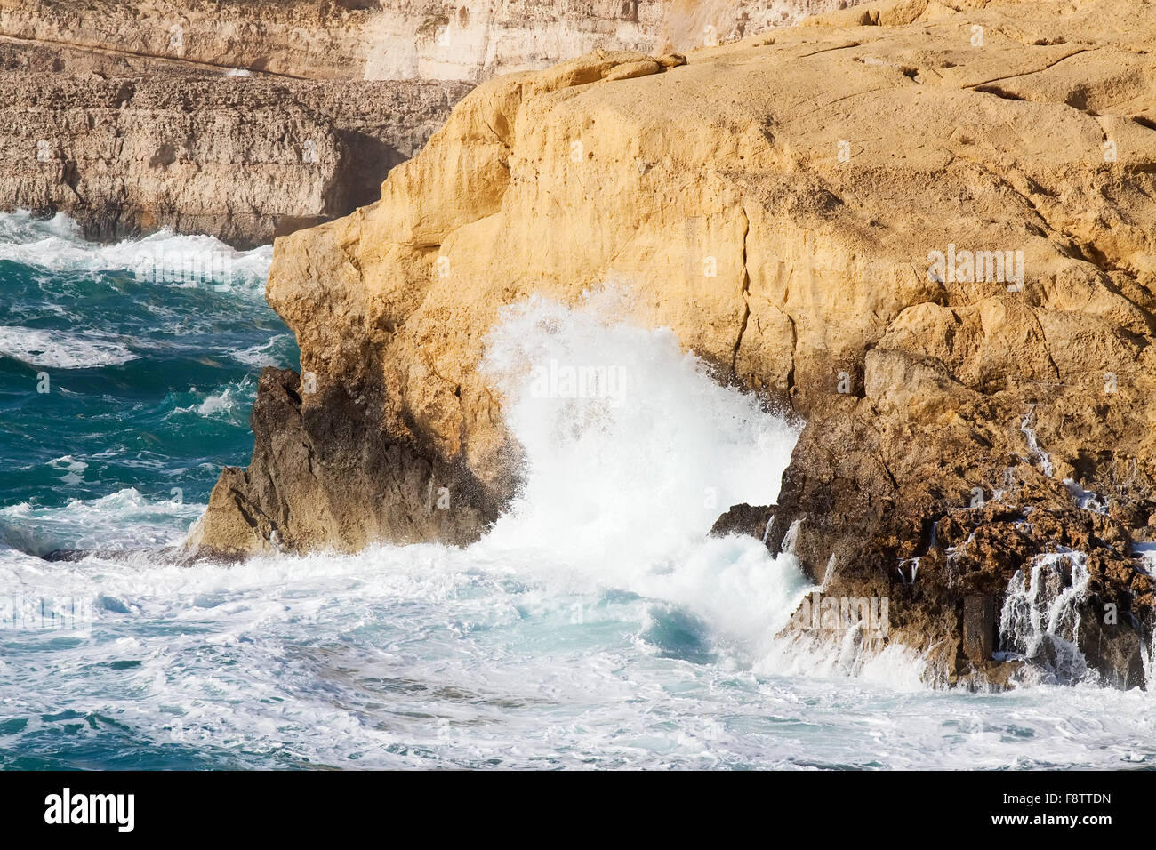 Storm. Sea wave breaking against coast cliff Stock Photo - Alamy