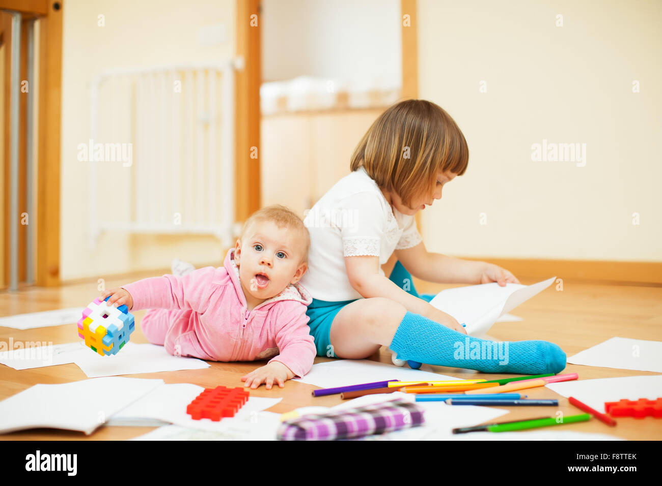 Two happy siblings together in home Stock Photo - Alamy