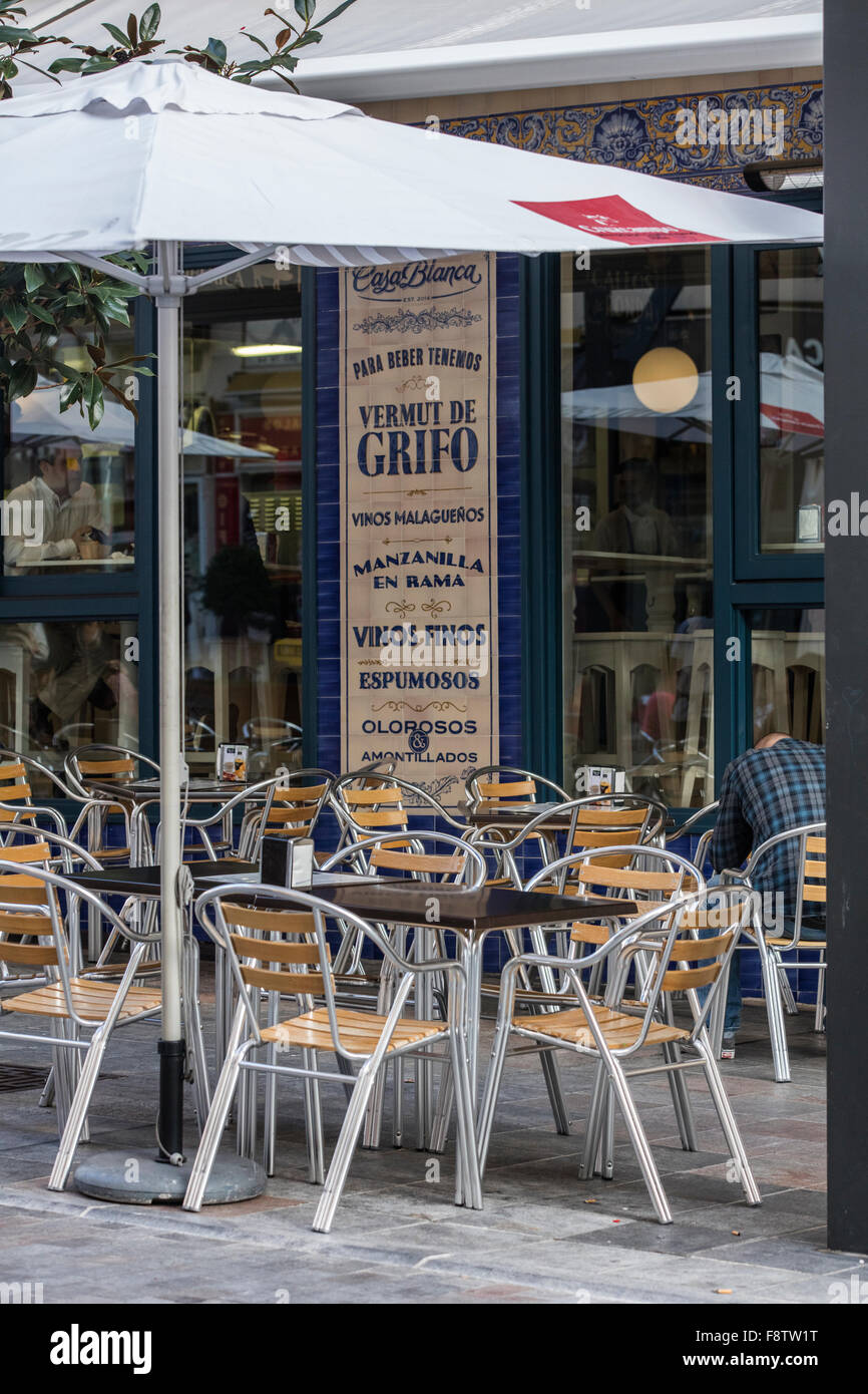 Outside of a very pleasant bar in Marbella spain with tables and chairs ...