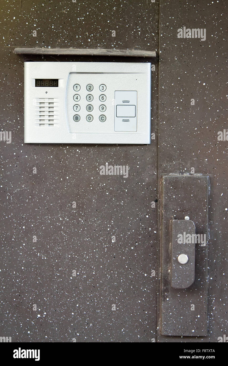 Close-up of building intercom in steel door Stock Photo - Alamy