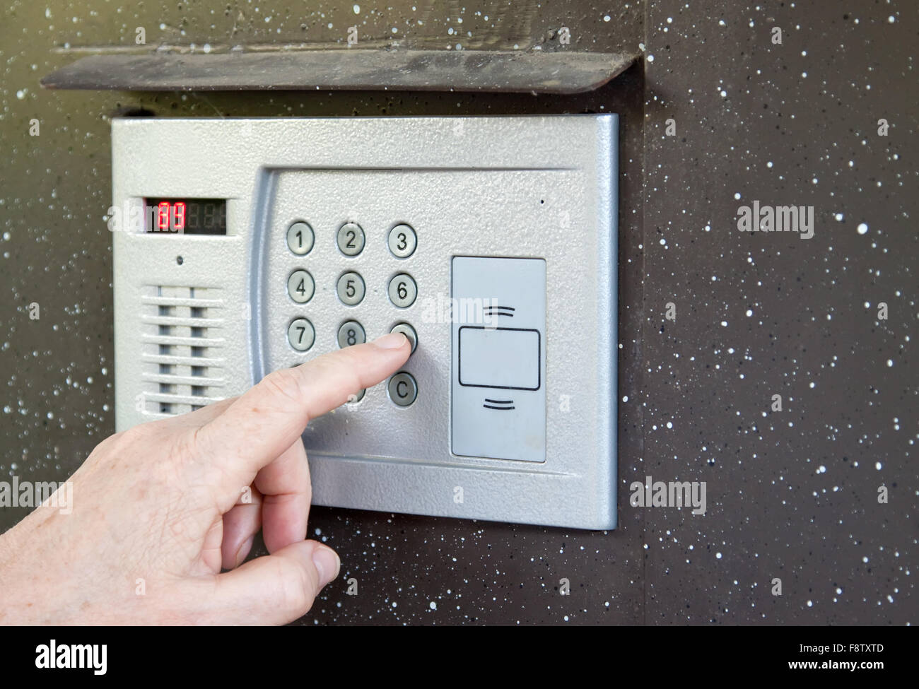 Close-up of uses intercom in steel door Stock Photo - Alamy