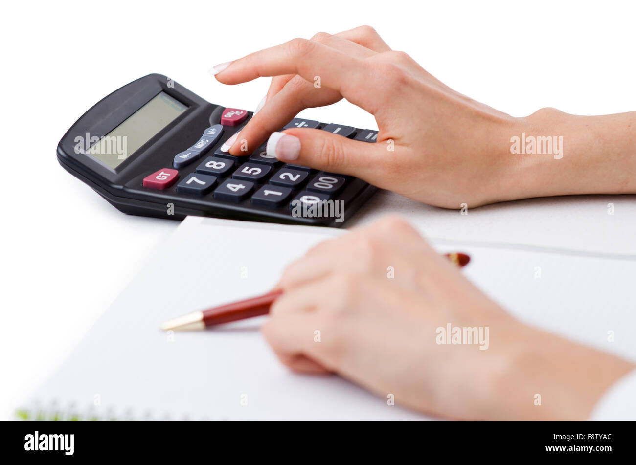 Hands working on the calculator Stock Photo - Alamy