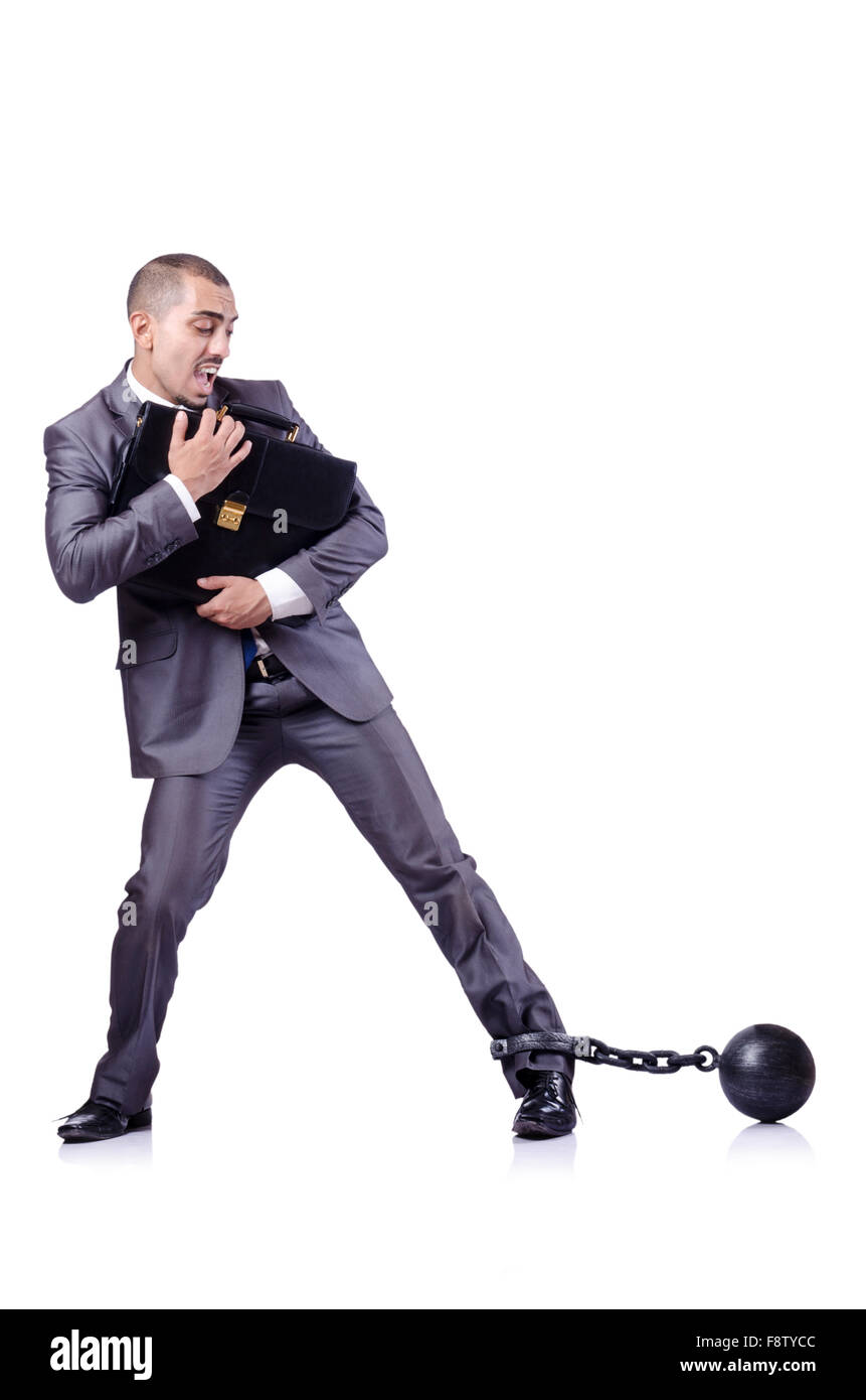 Businessman with shackles on white Stock Photo - Alamy