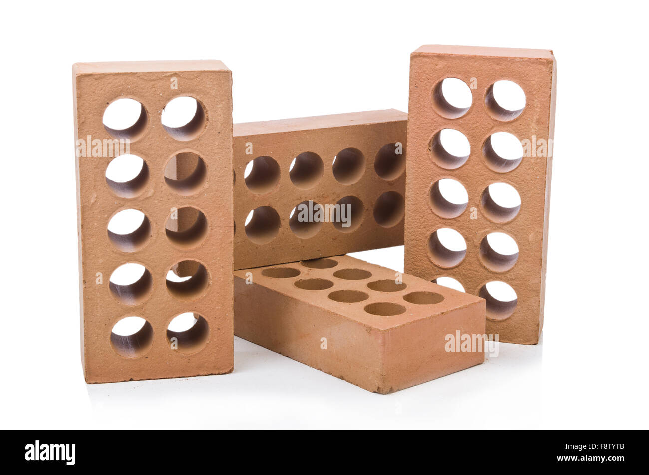 Stack of clay bricks isolated on white Stock Photo - Alamy