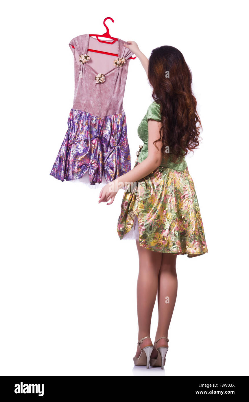 Woman trying to choose dress on white Stock Photo - Alamy