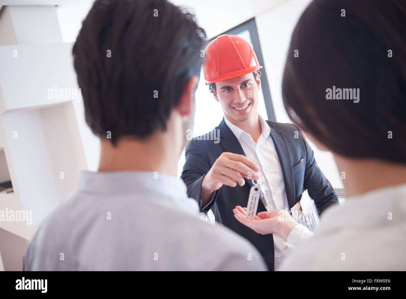 happy young family, couple buying new home with real estate agent ...