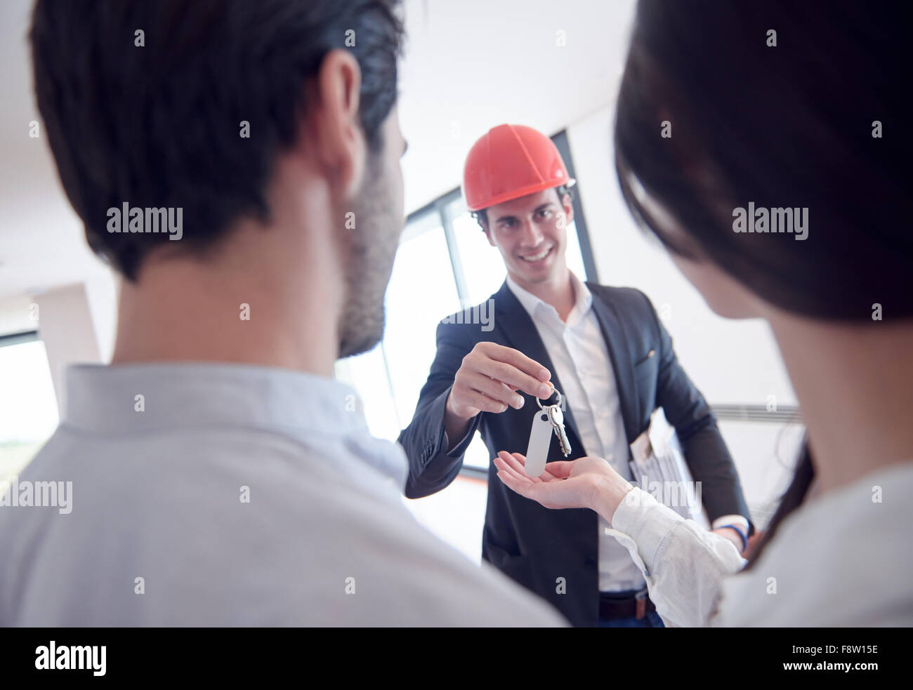 happy young family, couple buying new home with real estate agent ...