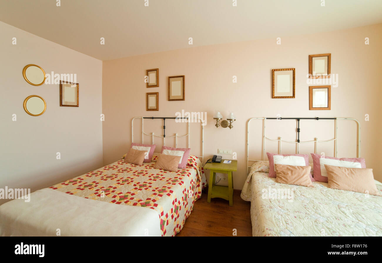 interior of bedroom with two double bed Stock Photo - Alamy