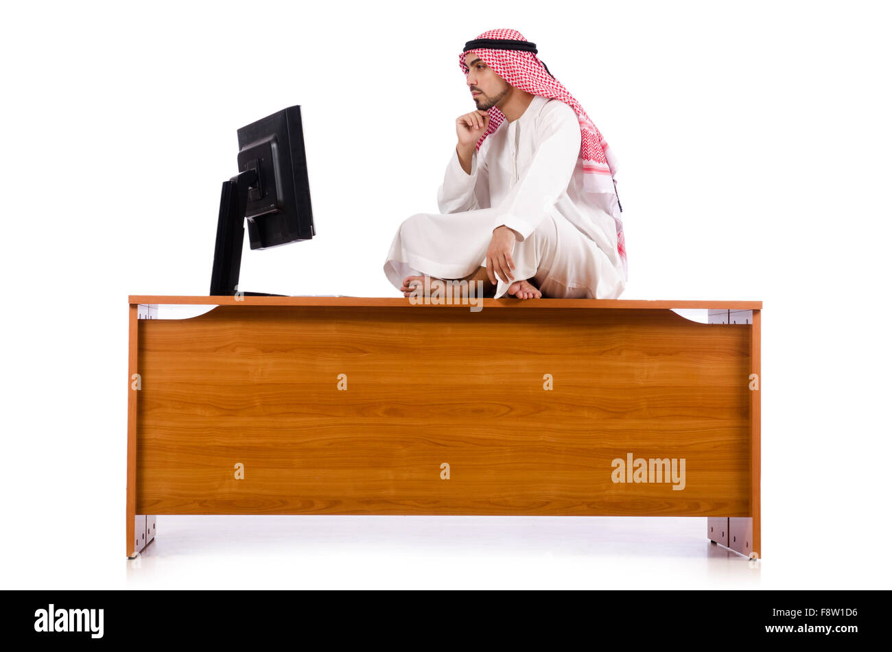 Arab man sitting at his desk Stock Photo - Alamy