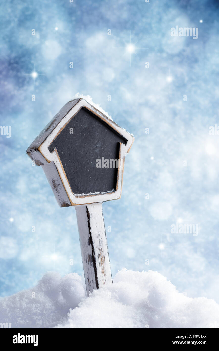 Blank sign in the snow with festive winter background Stock Photo - Alamy