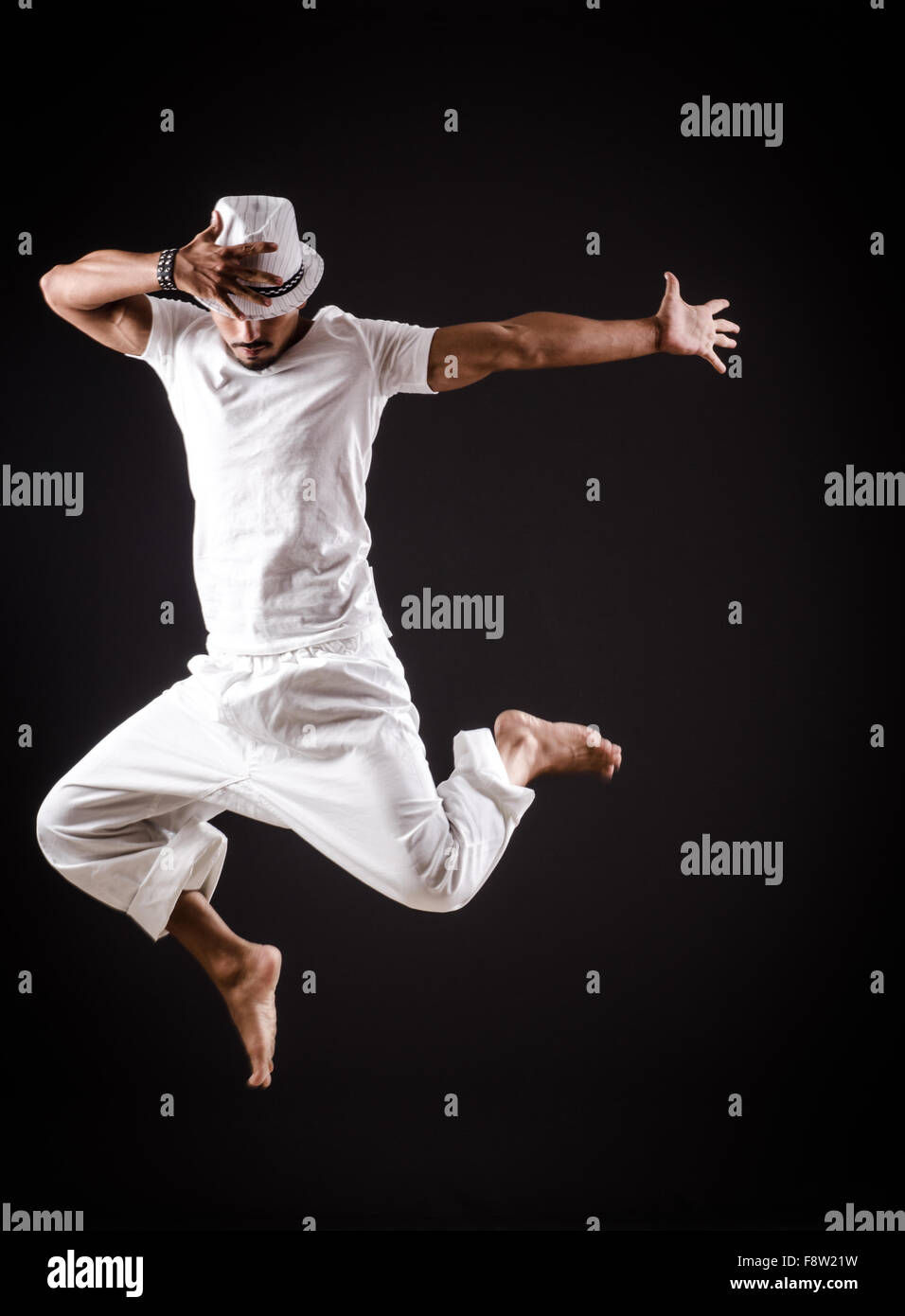 Dancer dancing dances in white clothing Stock Photo - Alamy