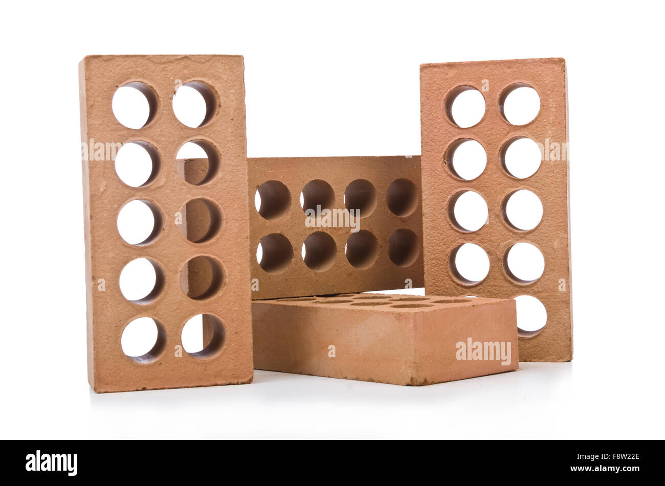 Stack of clay bricks isolated on white Stock Photo - Alamy