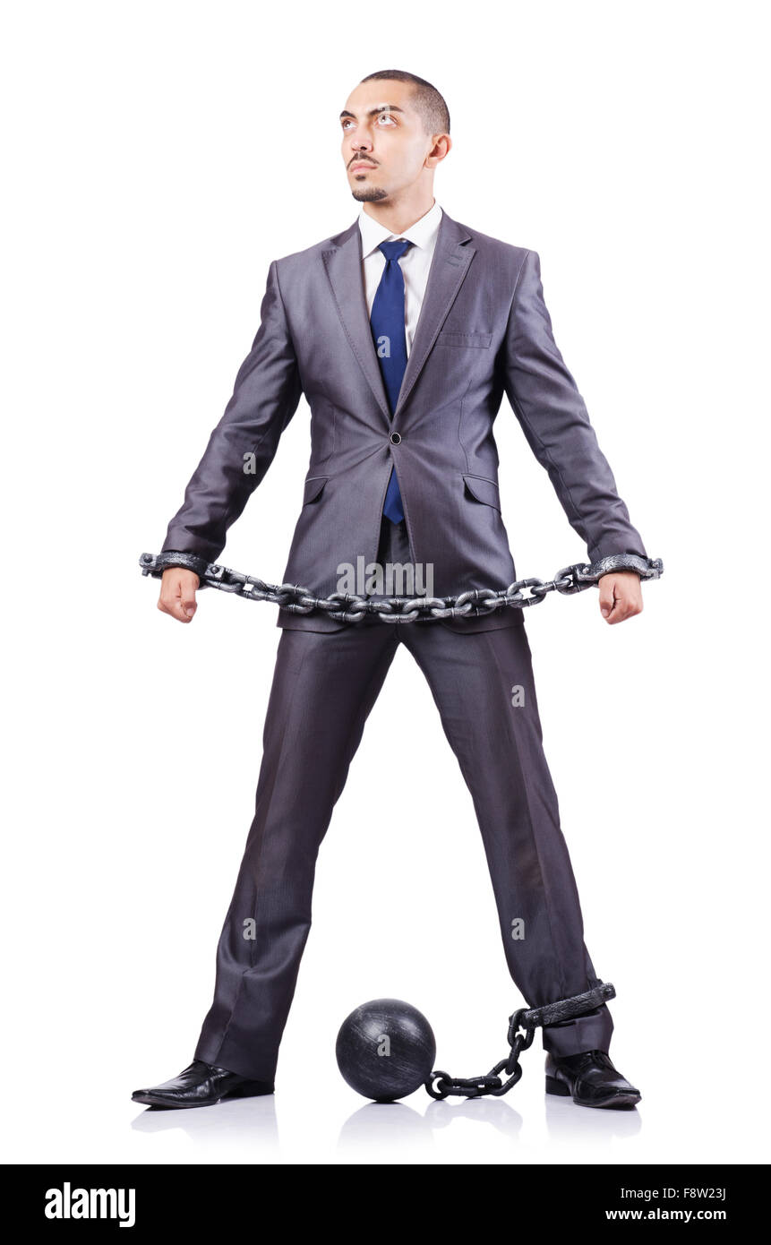 Businessman with shackles on white Stock Photo - Alamy
