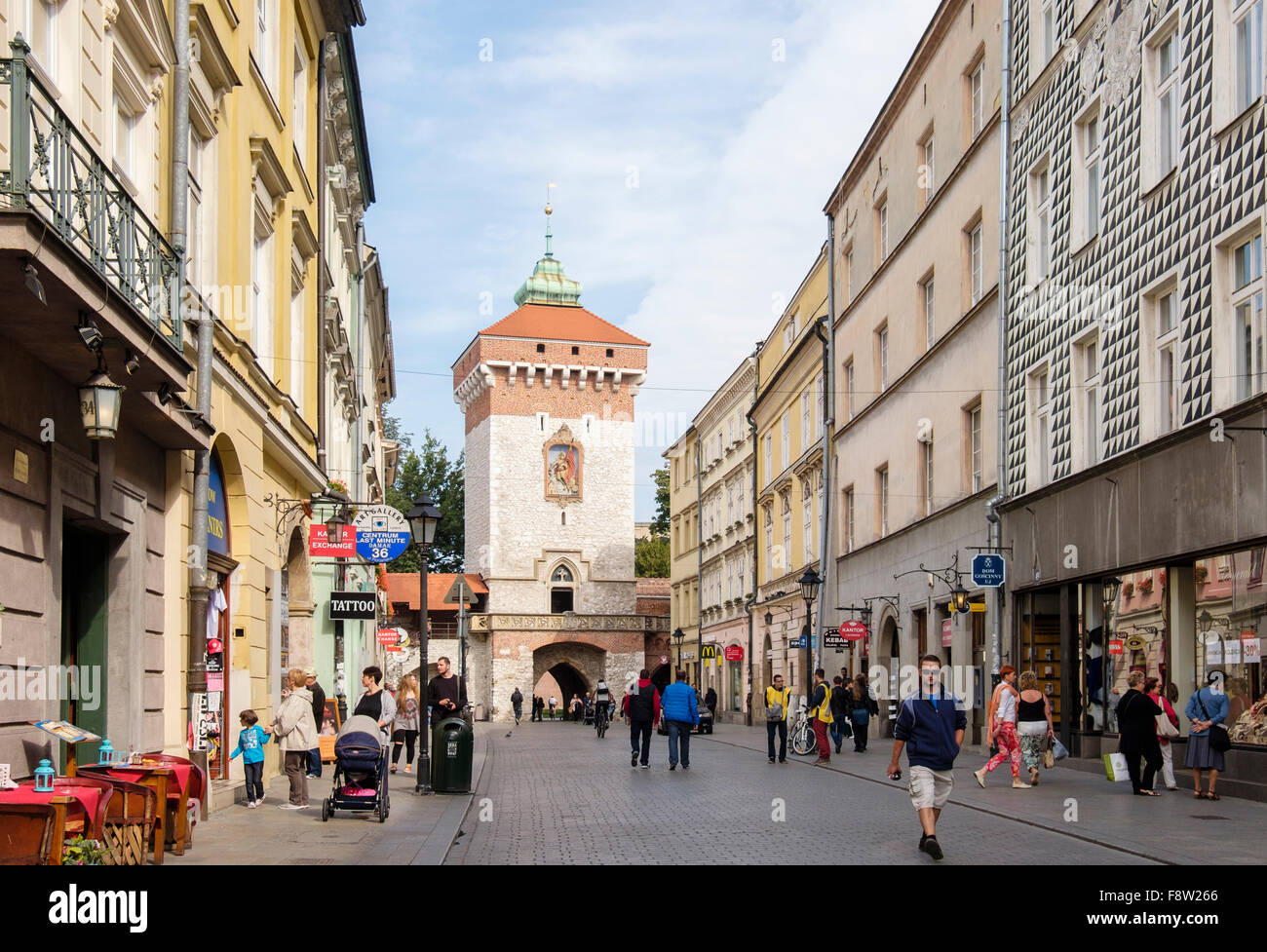 St. Florian's Gate and street scene with people and shops in Ulica ...